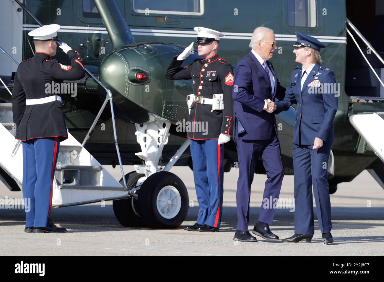 President Joe Biden, second from left, is greeted by Air Force Col ...