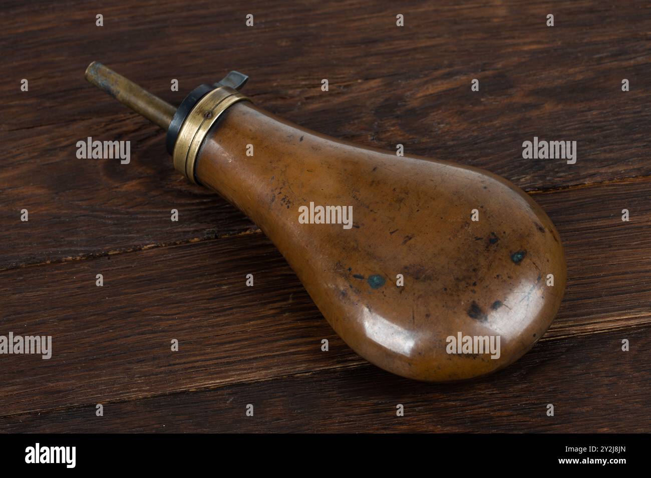 Old west gunpowder flask on wood deck background Stock Photo - Alamy