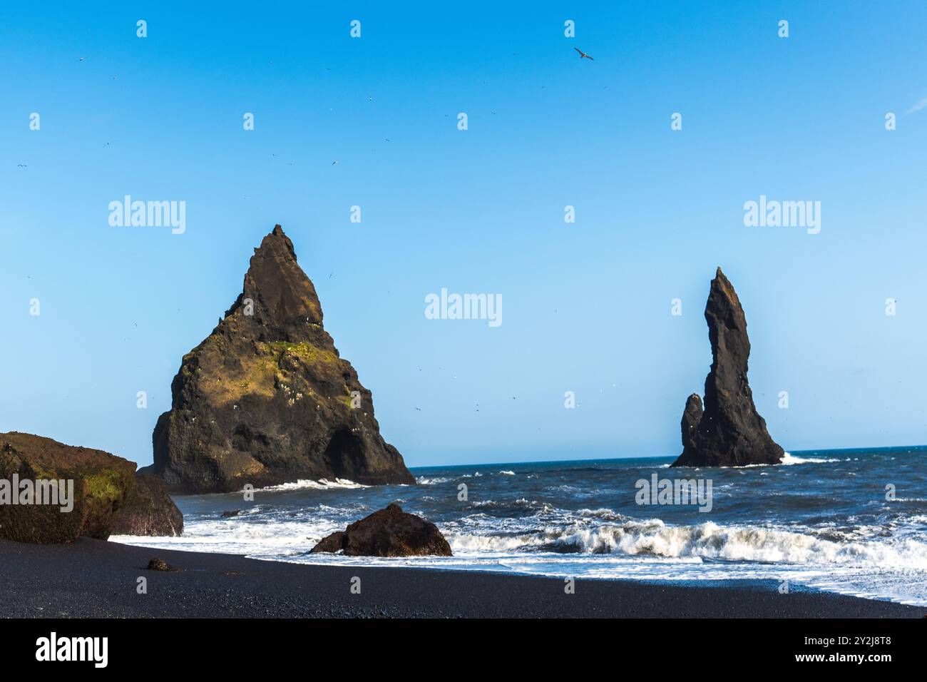 The dramatic Reynisfjara Beach features black volcanic sands and ...