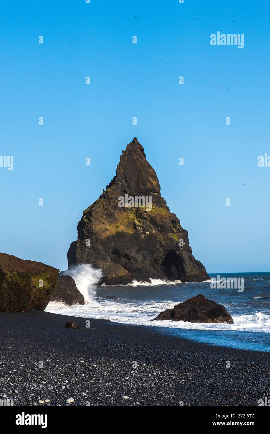 The dramatic Reynisfjara Beach features black volcanic sands and ...