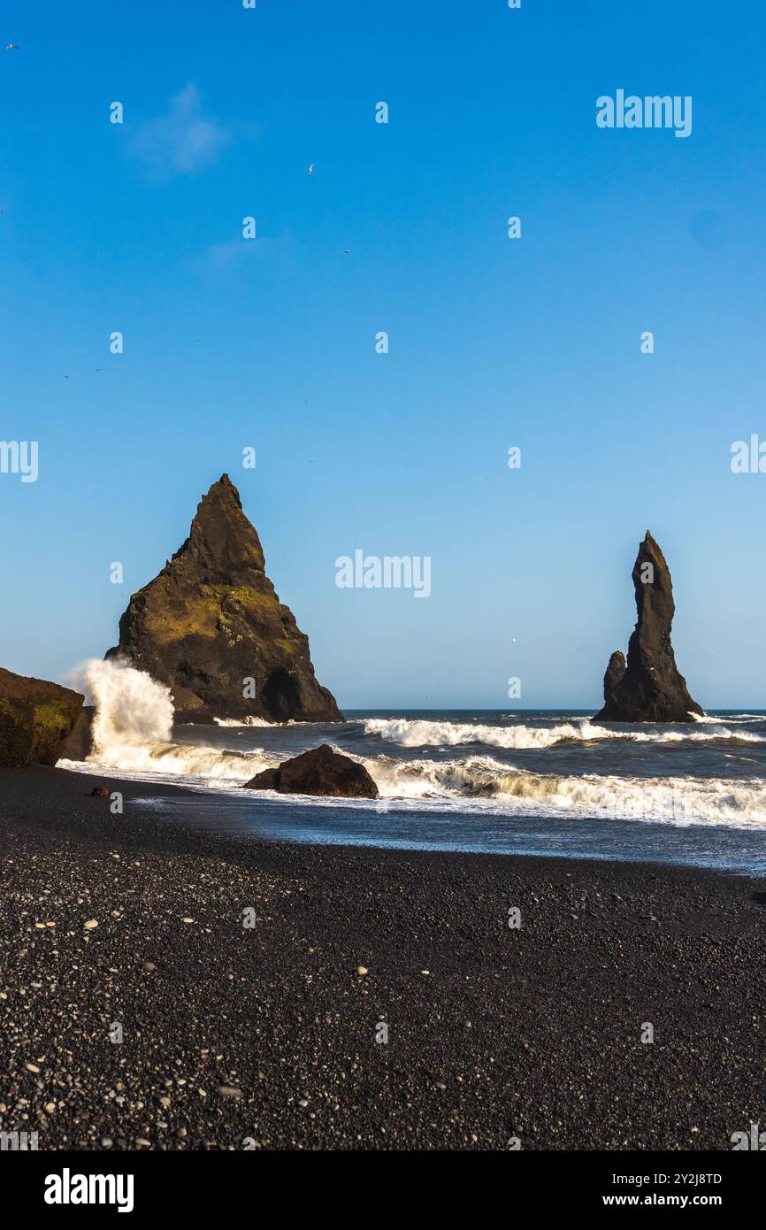 The dramatic Reynisfjara Beach features black volcanic sands and ...