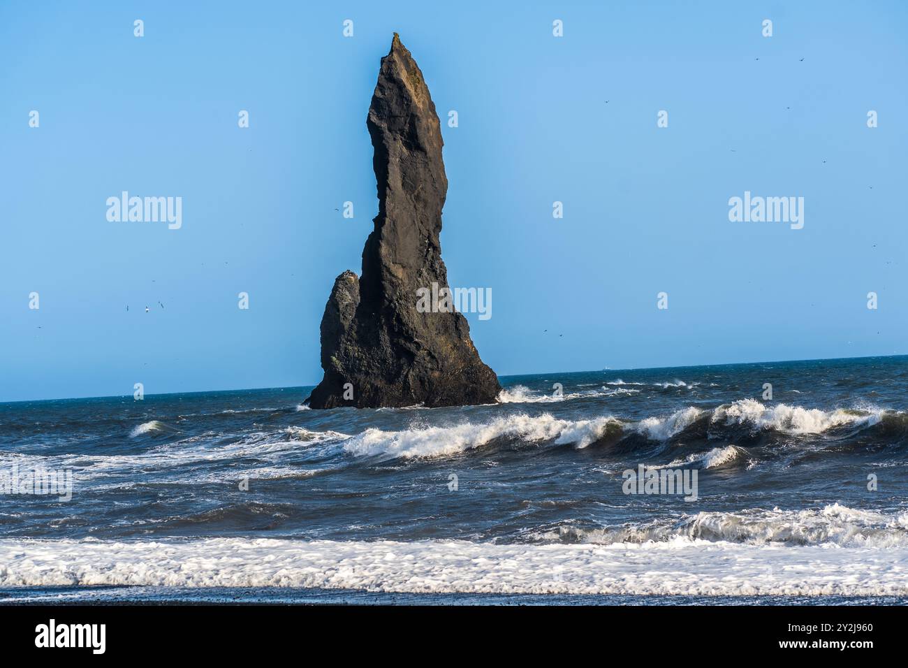 The dramatic Reynisfjara Beach features black volcanic sands and ...