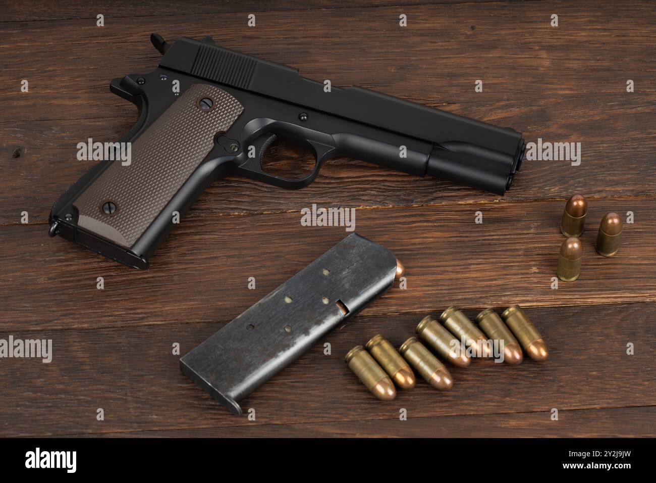 M1911 Automatic Pistol, Caliber .45 with magazine and ammunition on ...