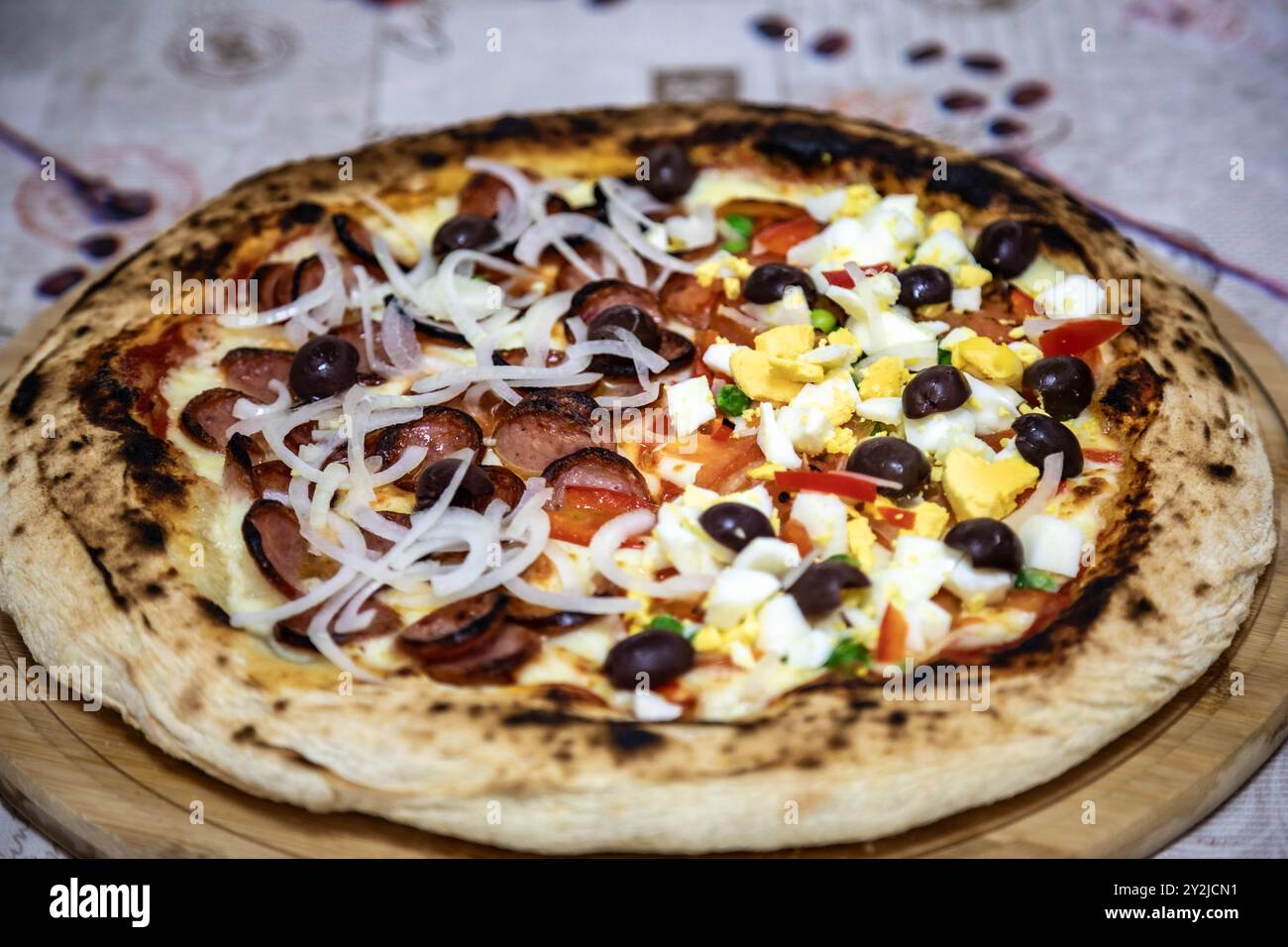 Traditional Brazilian pizza, half pepperoni with onions and half ...