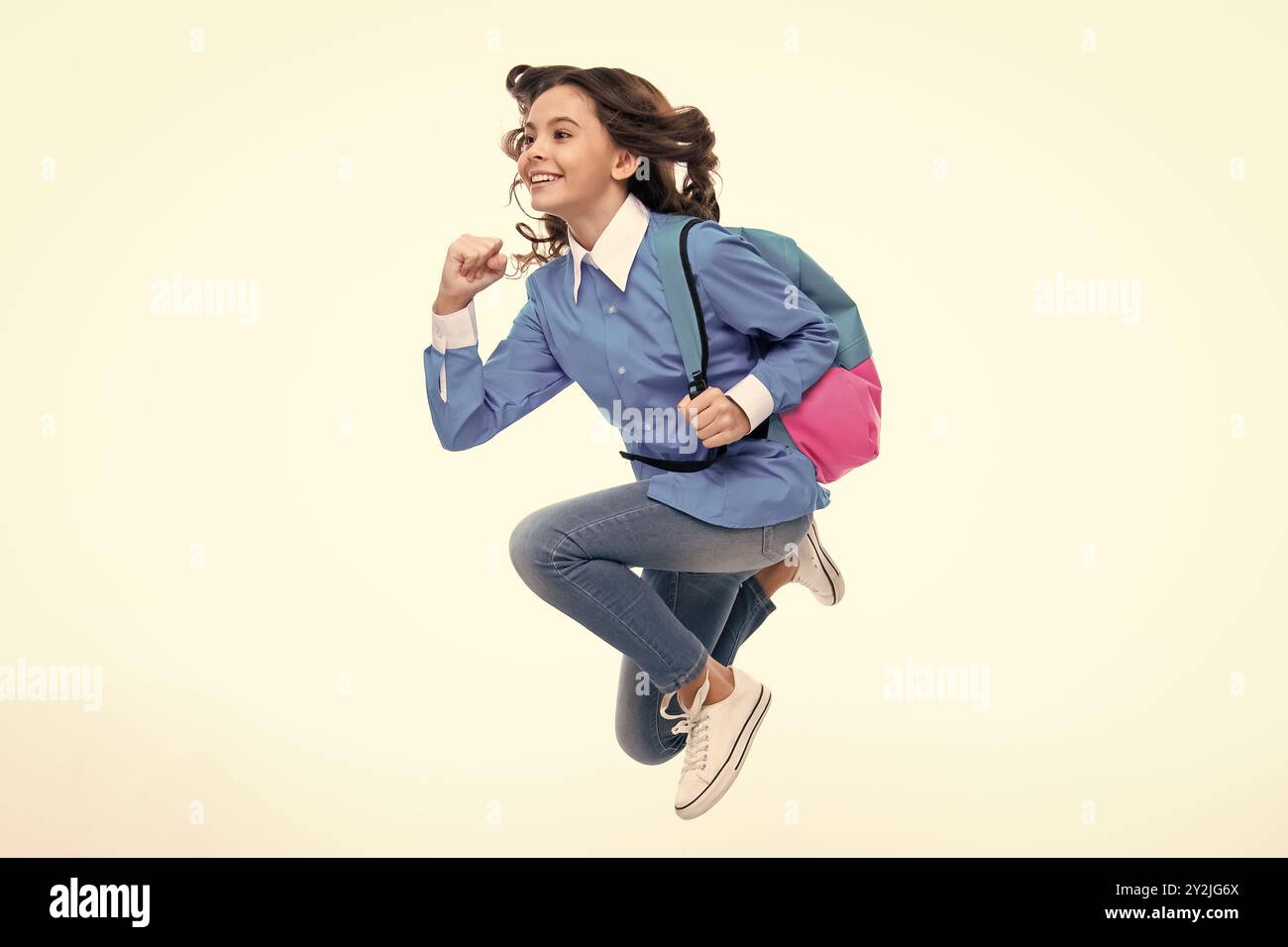 Back to school. Teenage school girl ready to learn. Run and jump ...