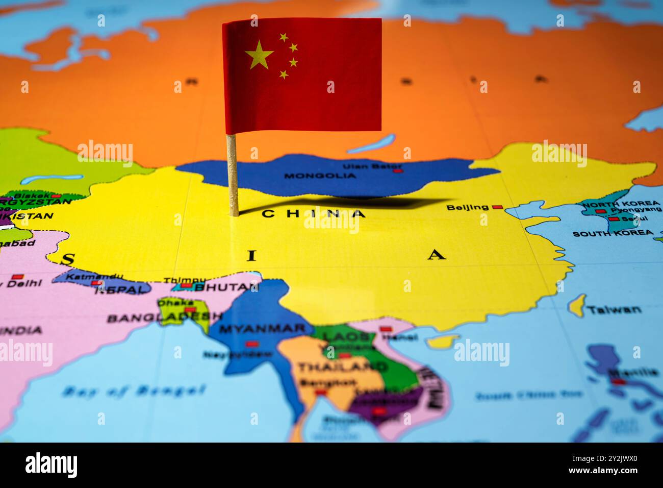 A map of China with a Chinese flag on it. The flag with red color ...