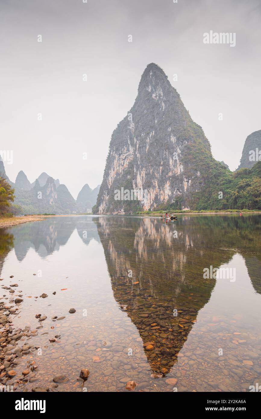The shores of the Li river in Xing Ping, Guilin, China. Cloudy sky with ...