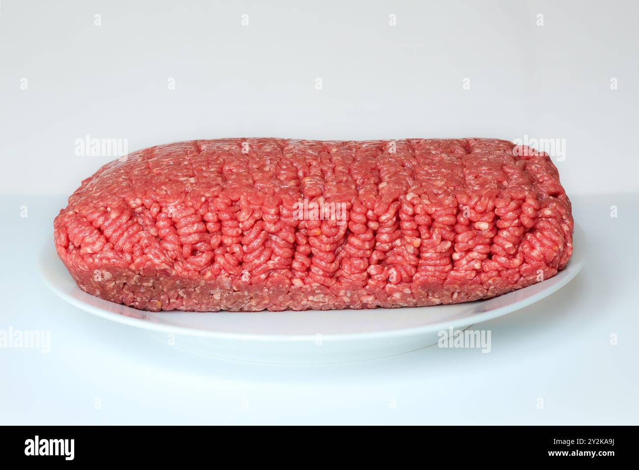 raw, fresh ground beef on white background Stock Photo - Alamy
