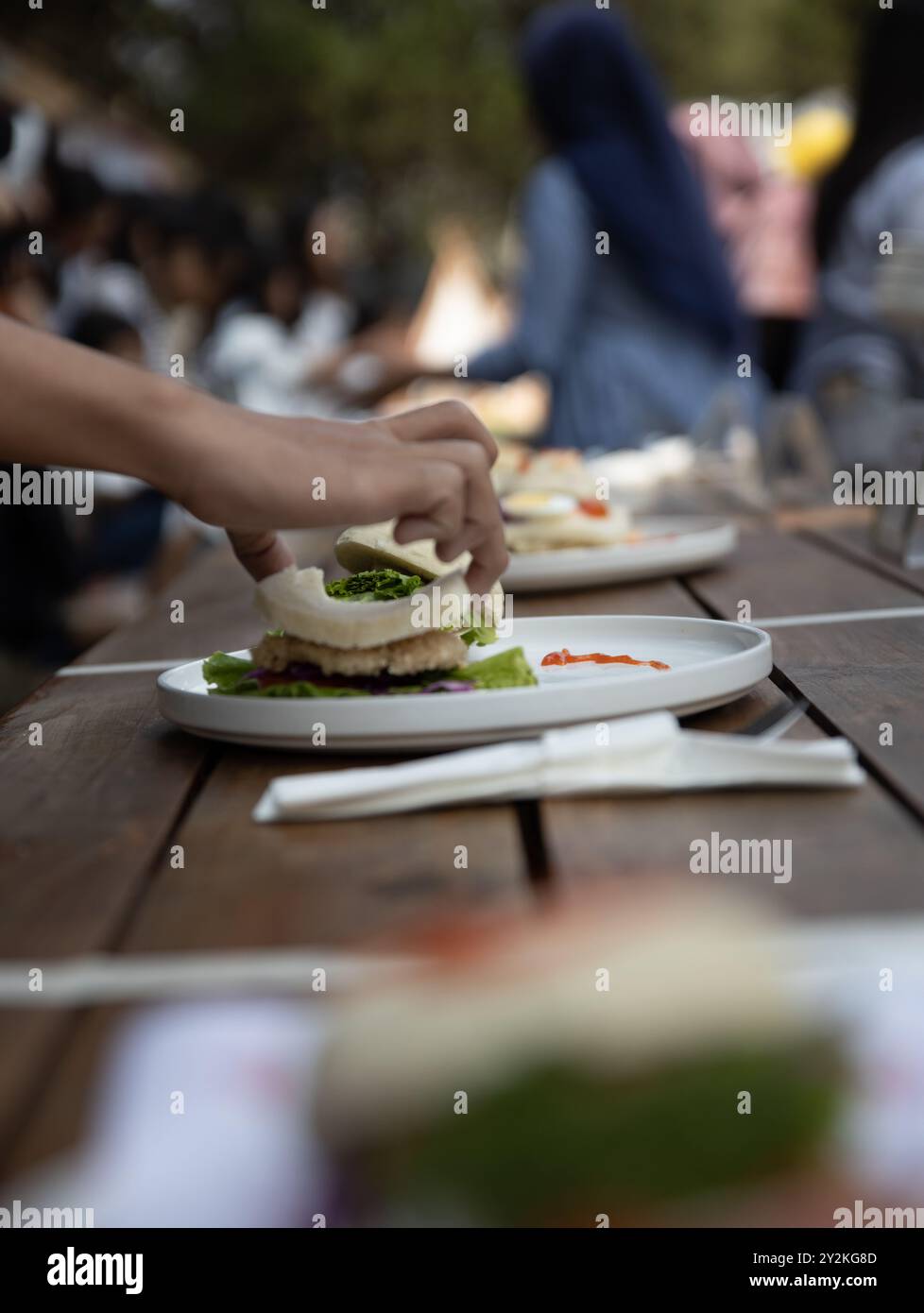 Children's burger making competition activities Stock Photo - Alamy