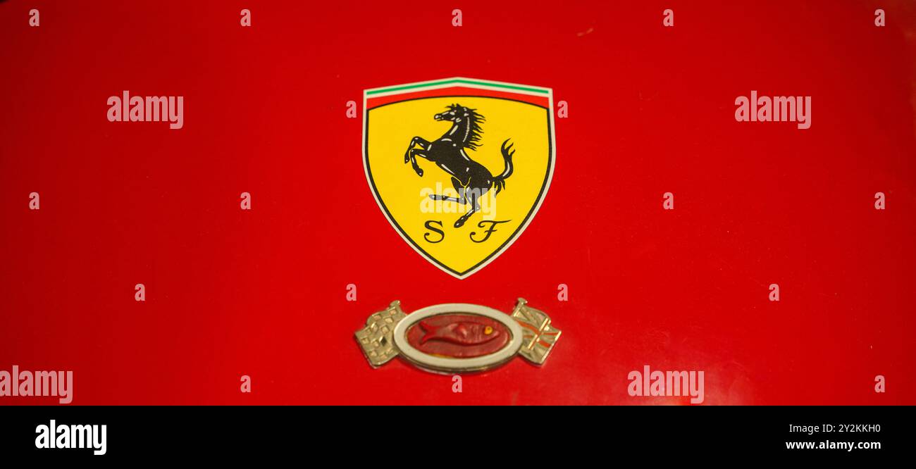 Ferrari Logo on Red Car Hood with Additional Emblem. High quality photo ...