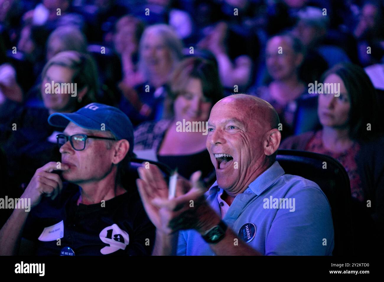 Chris Covert, front right, from Leawood, Kan., watches the presidential ...