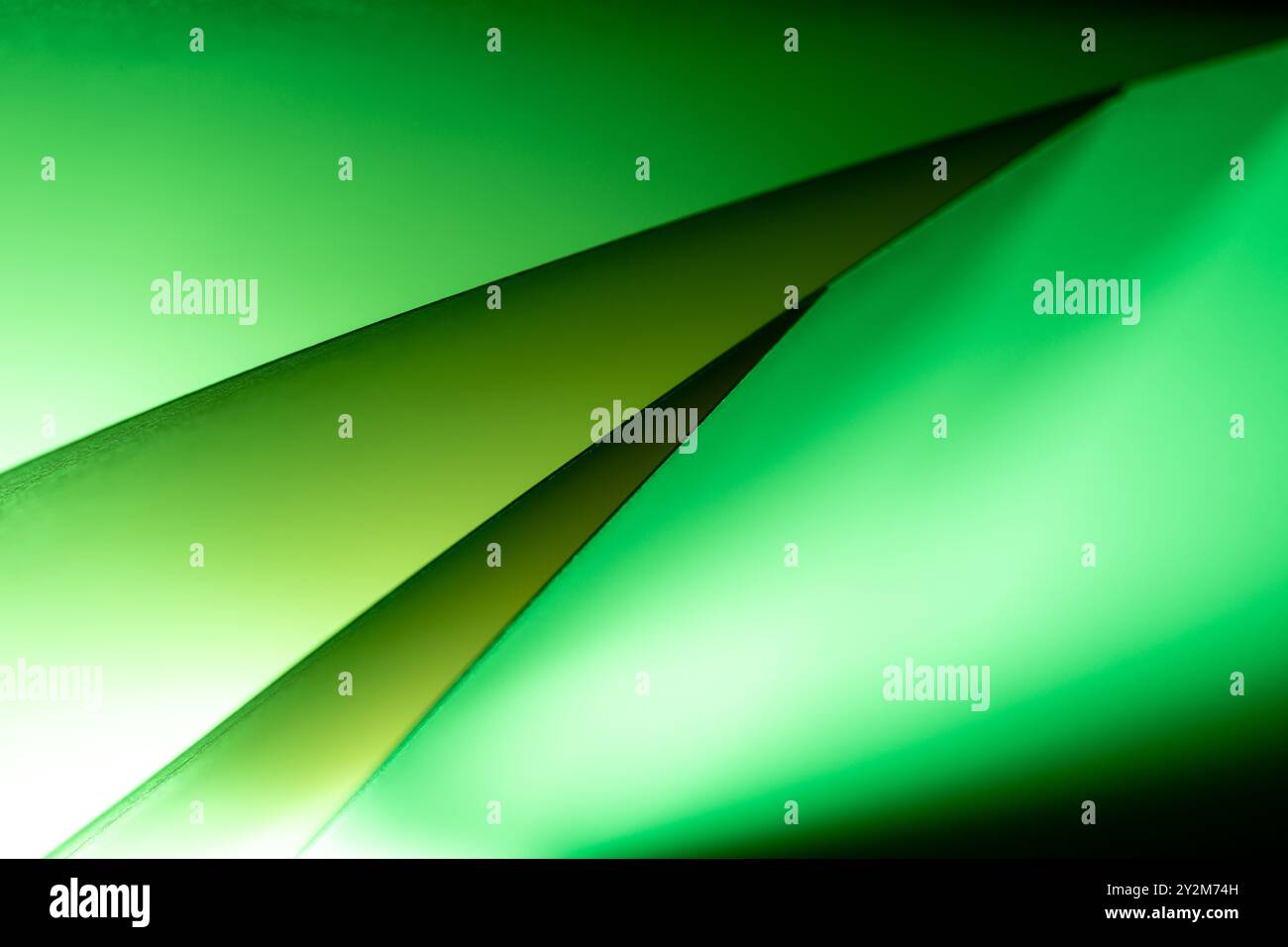 Curved shapes in vibrant green and black blend together harmoniously ...