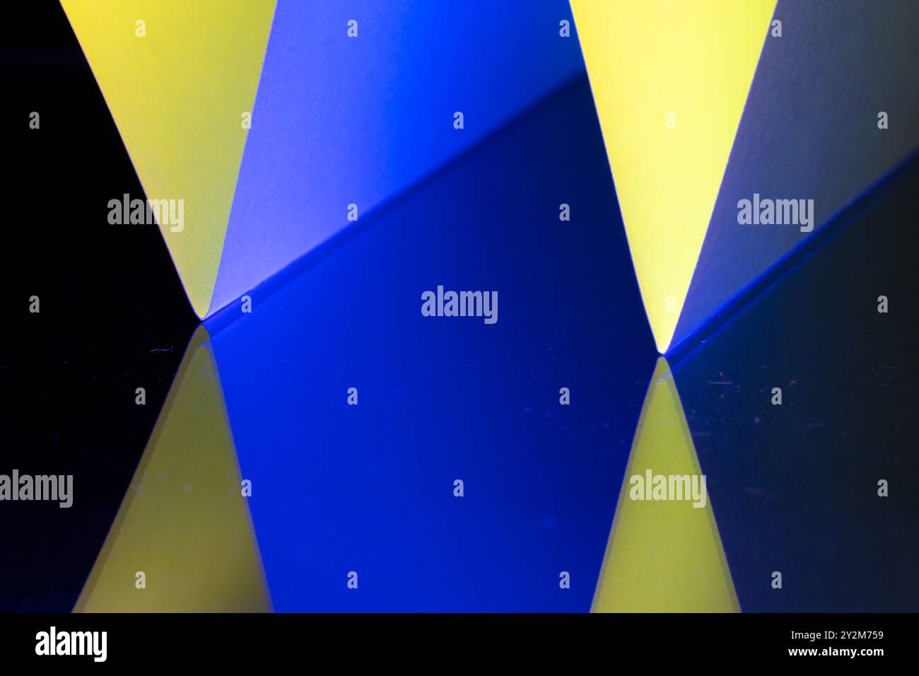 Sharp angles and vivid hues in different blue and yellow tints with ...