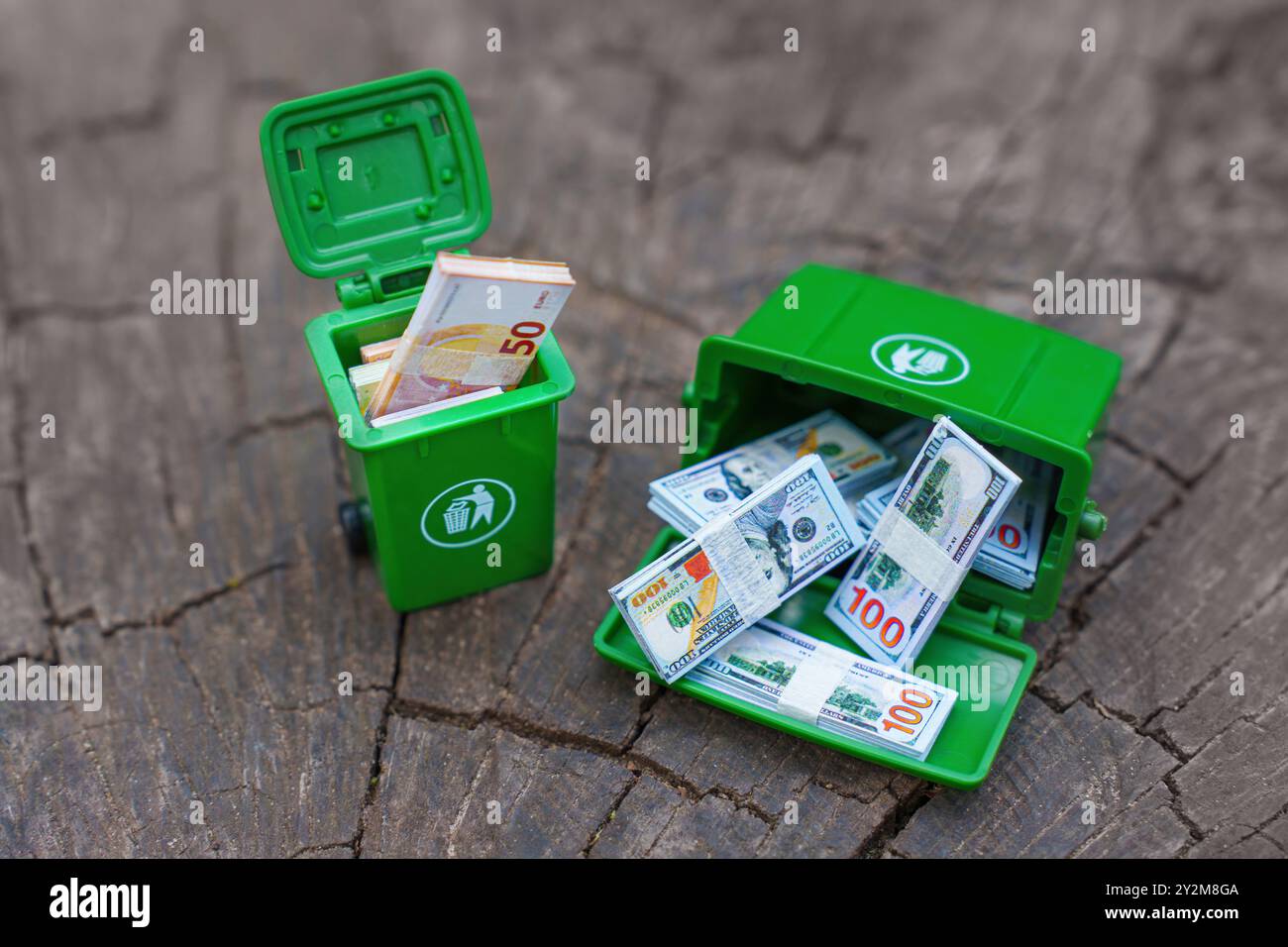 Green bins overflow with colorful currency notes, symbolizing cash ...