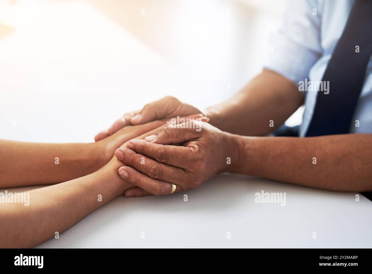 Holding hands, psychologist and patient for comfort, talking or ...