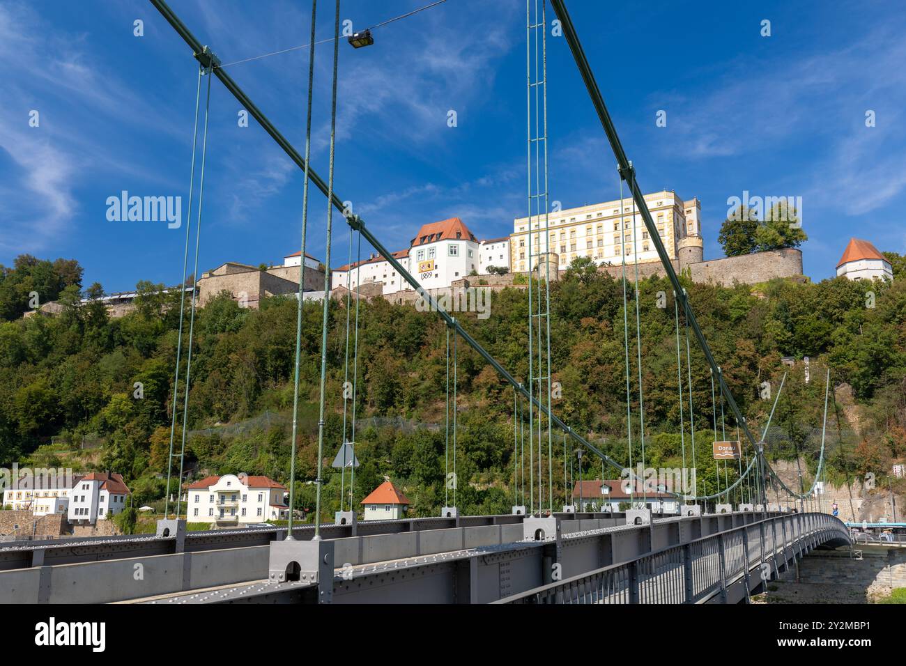 Suspension bridge in front of fortress Oberhaus in Passau, Bavaria ...