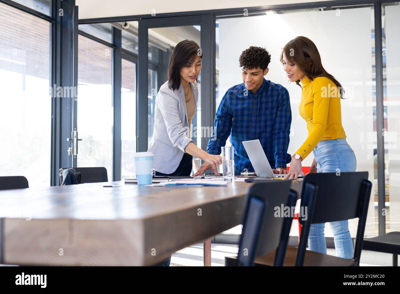 At office, Collaborating on interior design project, diverse team using ...