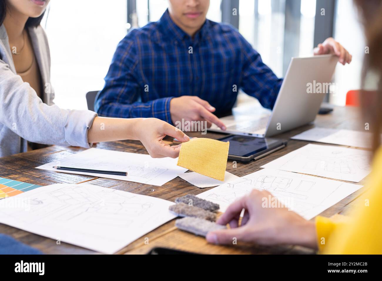 Reviewing blueprints at table hi-res stock photography and images - Alamy