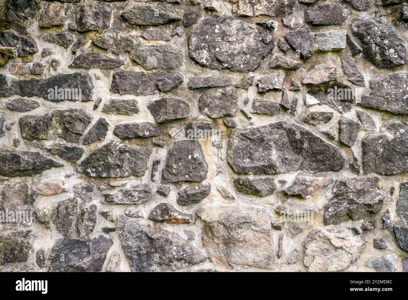 Old rustic stone wall of a medieval castle complex Stock Photo - Alamy