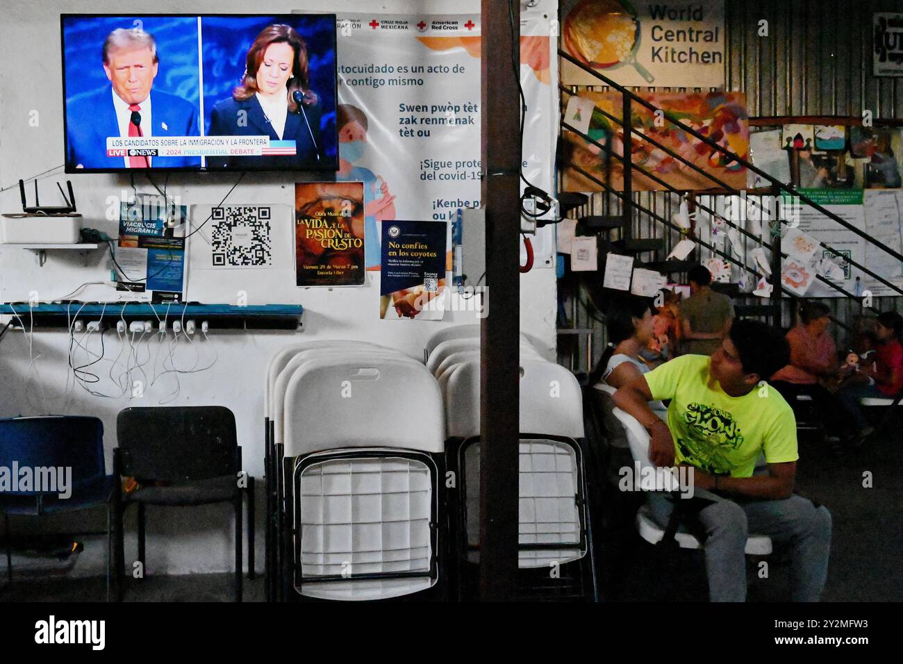 Tijuana, Baja California, Mexico. 10th Sep, 2024. Migrants watch the ...