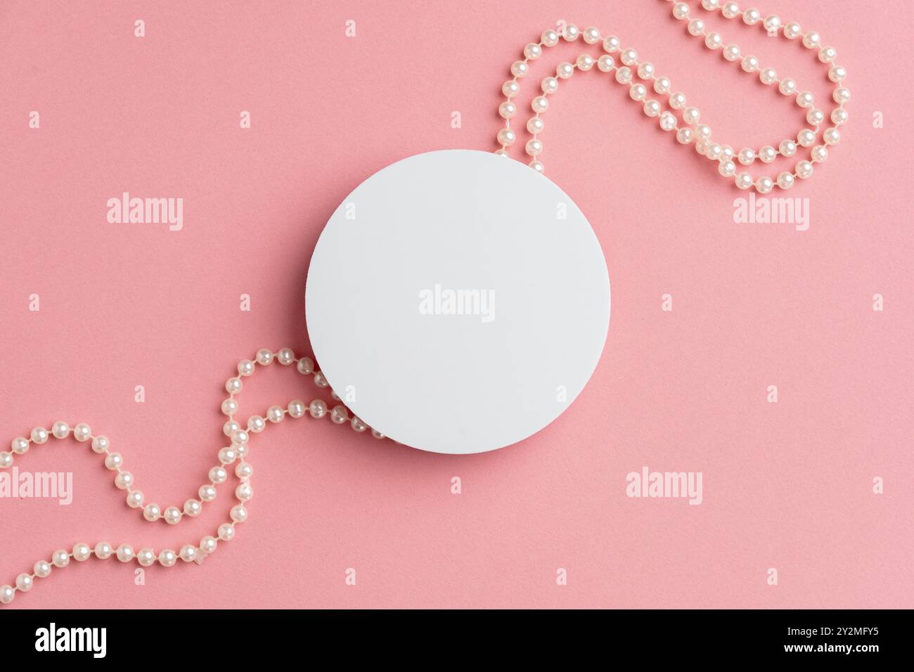 Elegant Round White Surface Surrounded by String of Pearls on Soft Pink ...