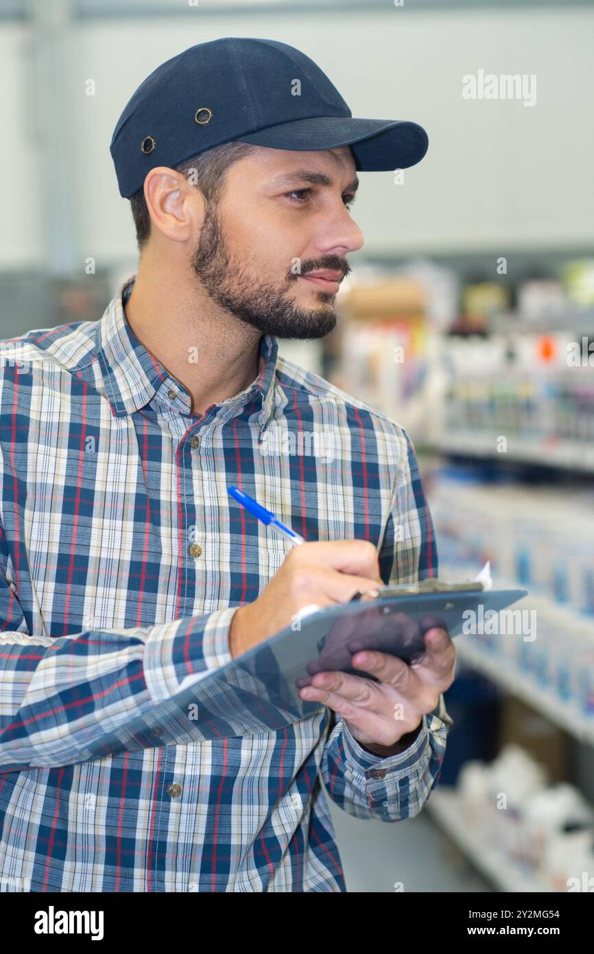 inventory staff inspecting the missing product Stock Photo - Alamy