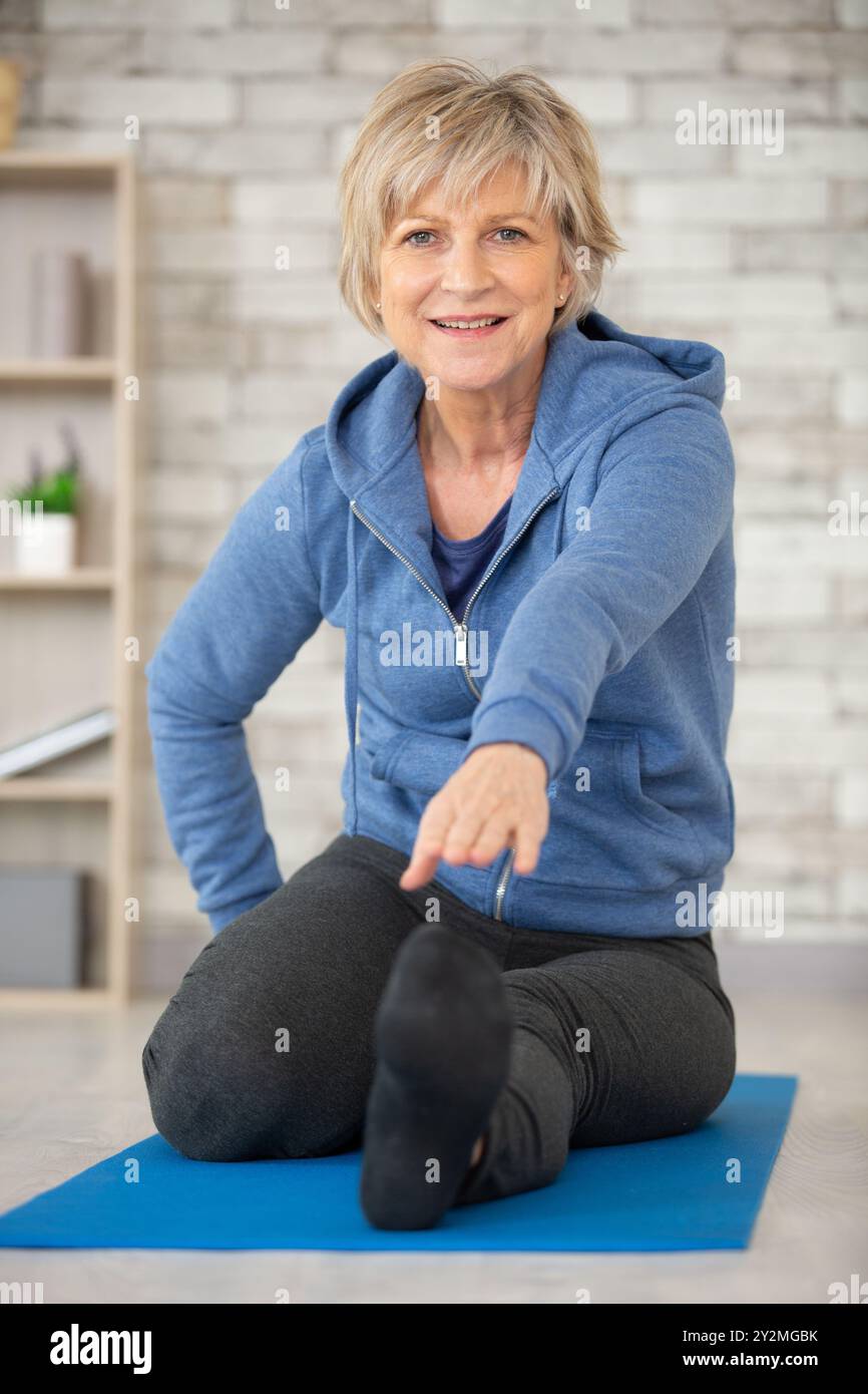 Elderly woman stretching her leg hi-res stock photography and images ...