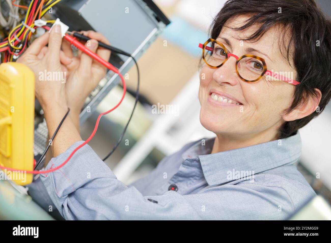 female worker measuring a pc Stock Photo - Alamy