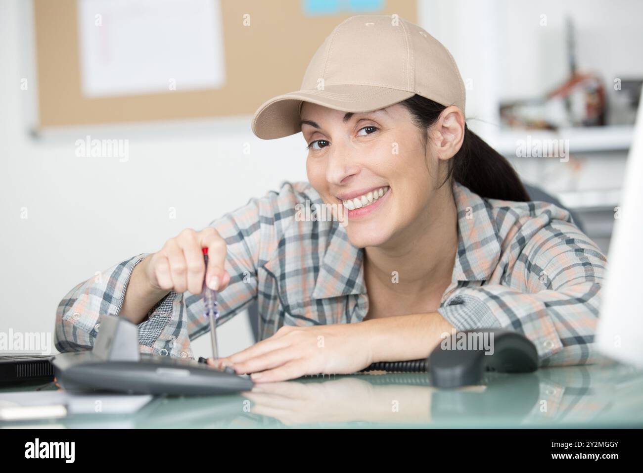 female computer engineer repairing computer motherboard Stock Photo - Alamy