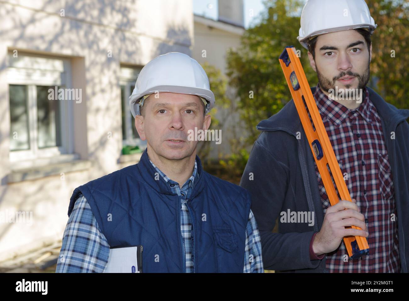 two builders outdoors Stock Photo - Alamy