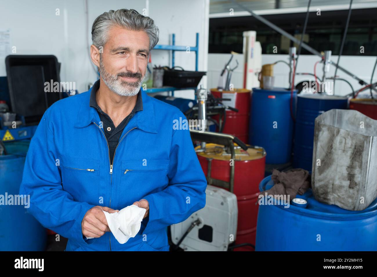 mechanic cleaning his hands at car station Stock Photo - Alamy