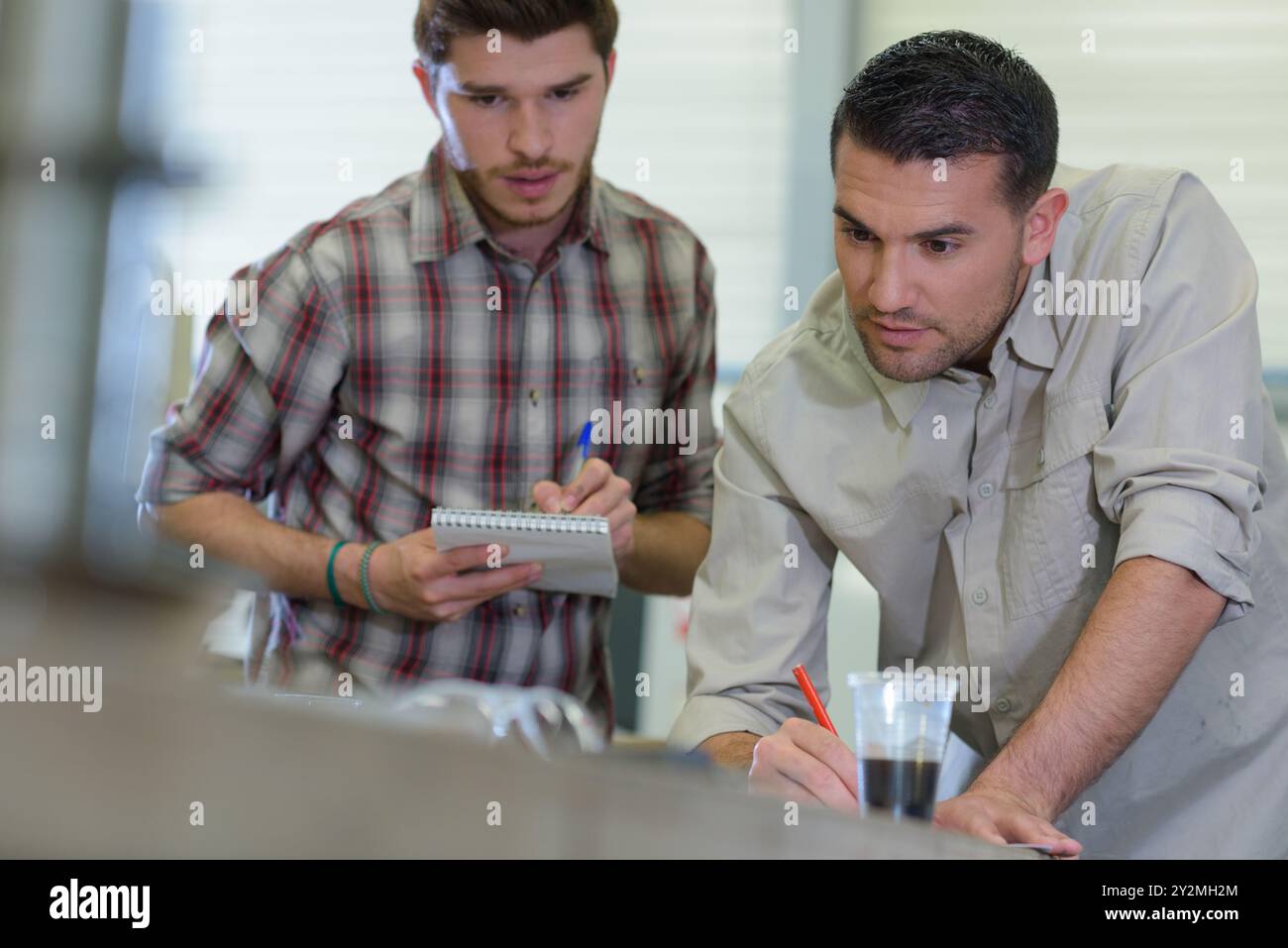 Two quality control experts discussing hi-res stock photography and ...