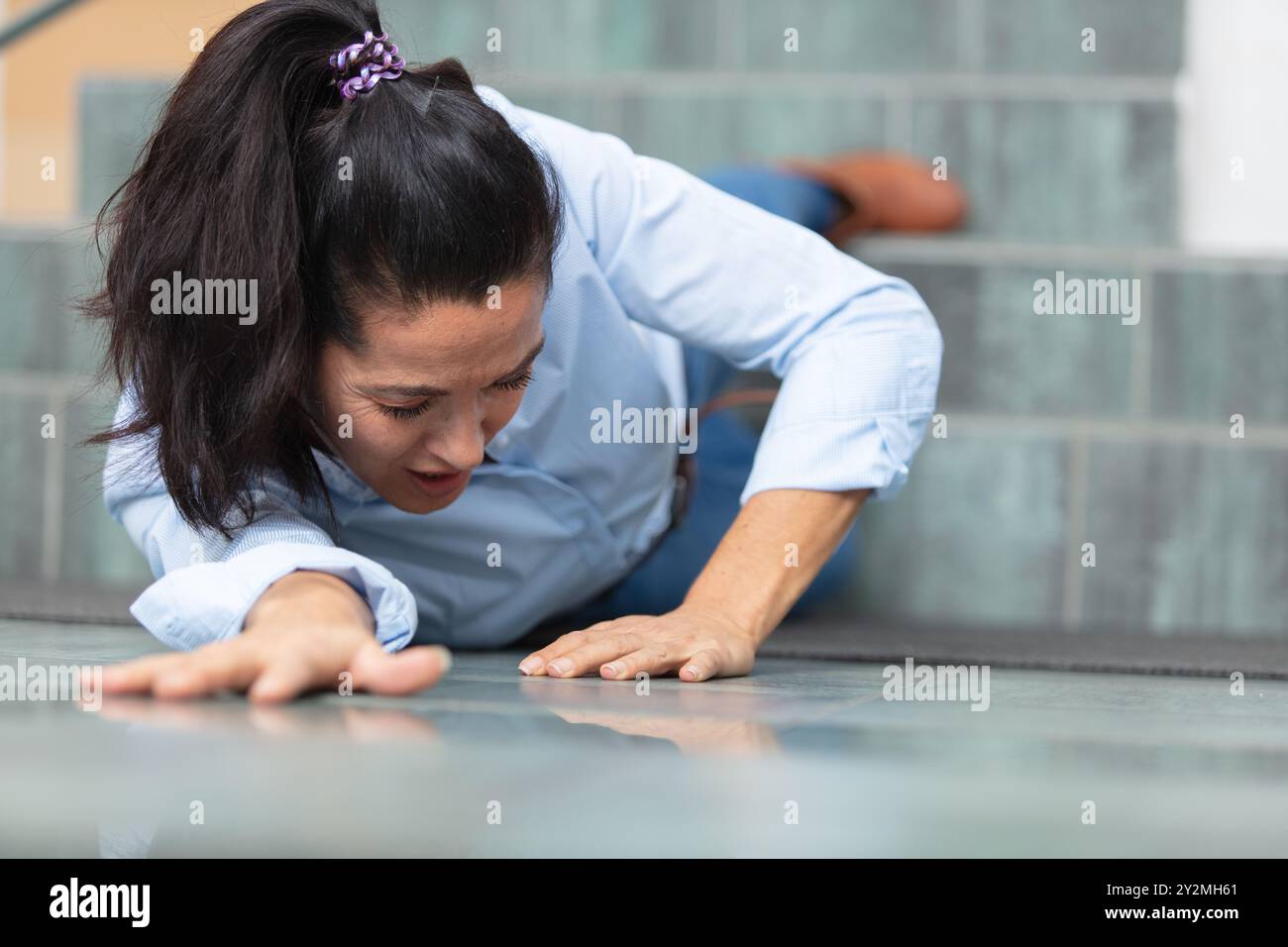 Woman falling down stairs hi-res stock photography and images - Alamy
