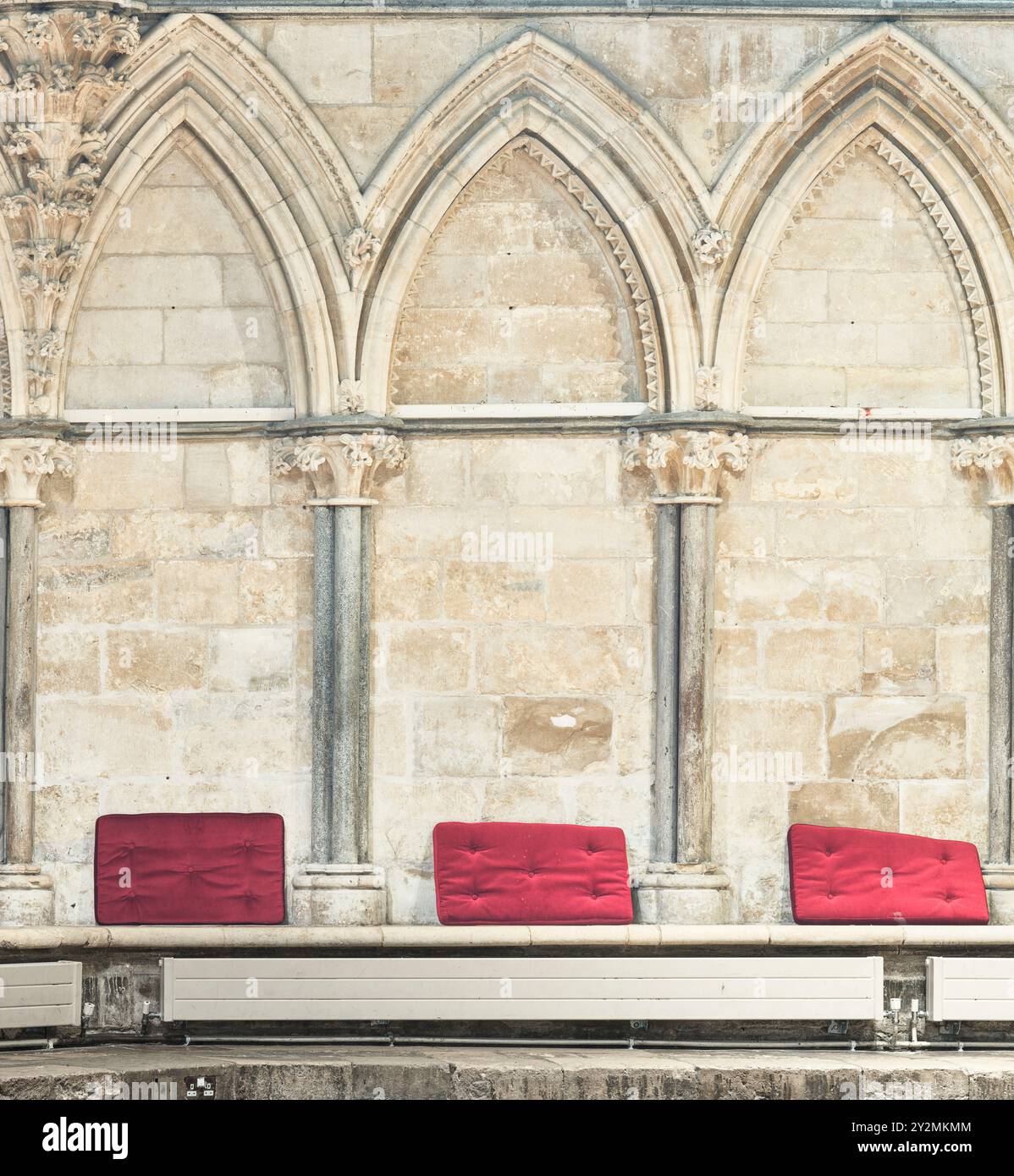 Cushioned seats on a wall in the chapter house at the gothic cathedral ...