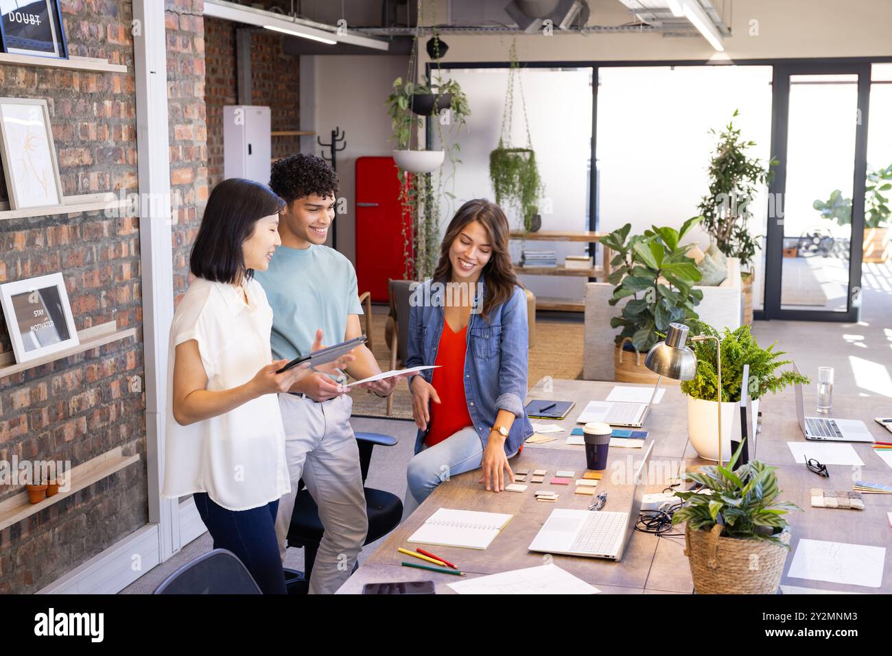 Collaborating on interior design project, diverse team discussing ideas ...