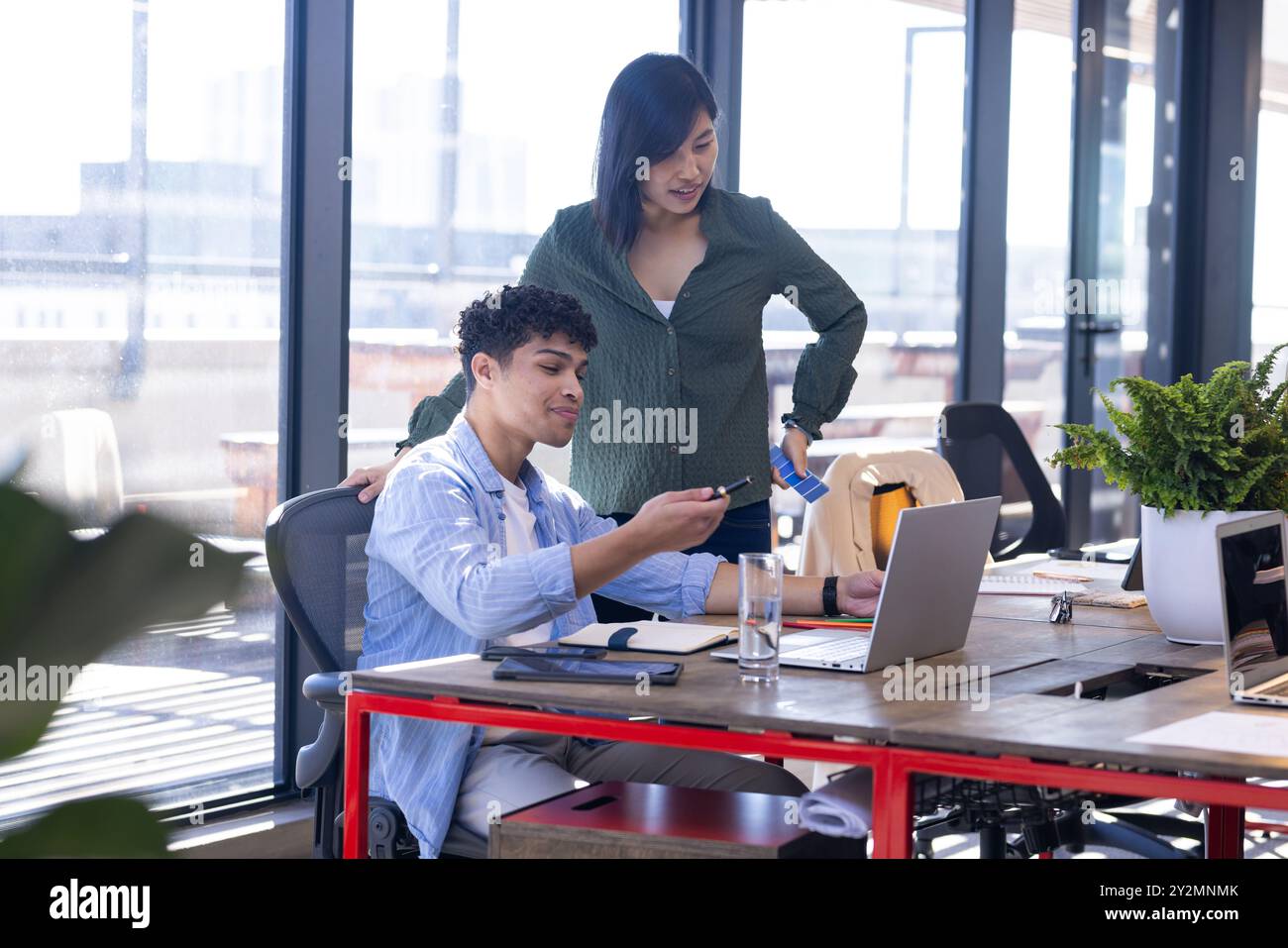 In office, discussing ideas, diverse colleagues collaborating on ...