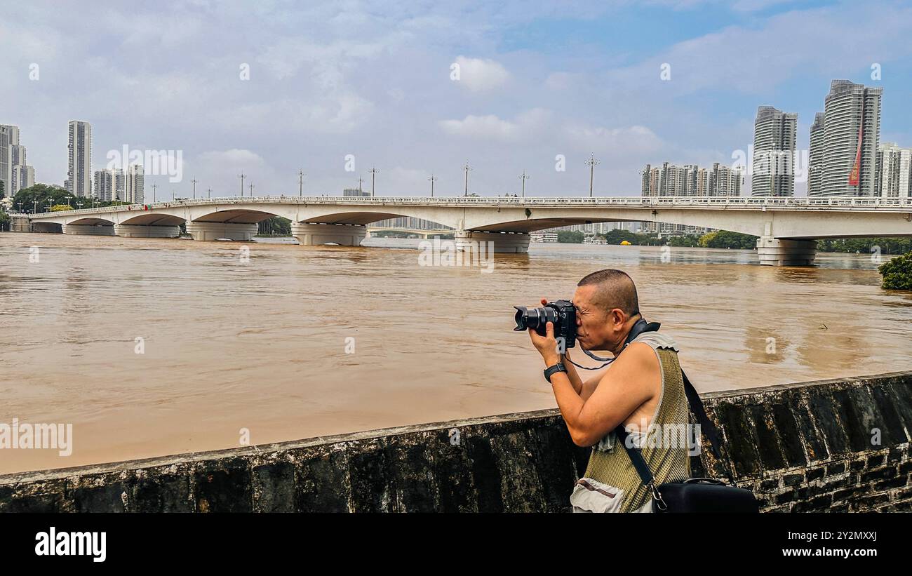 NANNING, CHINA - SEPTEMBER 11, 2024 - Citizens watch flood waters at ...
