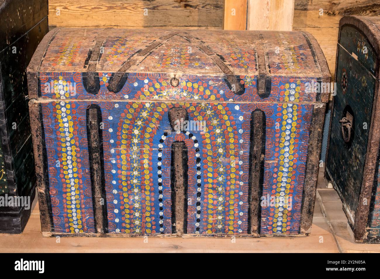 Old wooden chest against wooden wall Stock Photo - Alamy