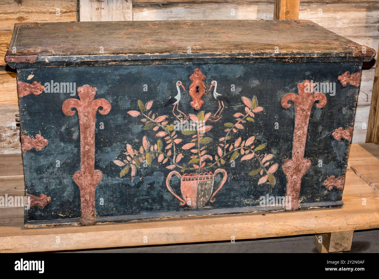 Old wooden chest against wooden wall Stock Photo - Alamy