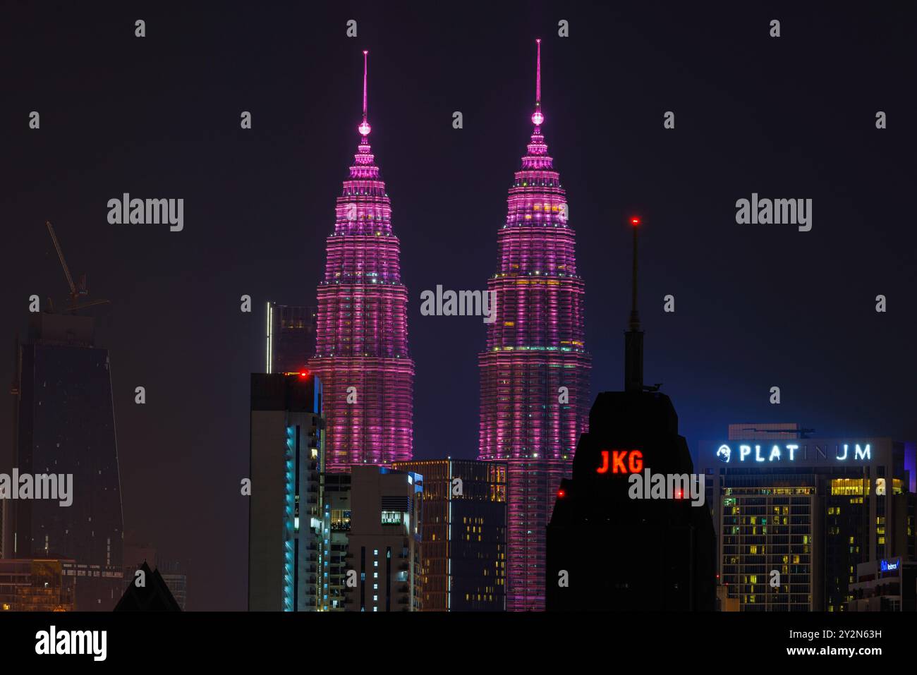 Petronas Twin Towers (KLCC) with Malaysia red flag colors, in Kuala ...