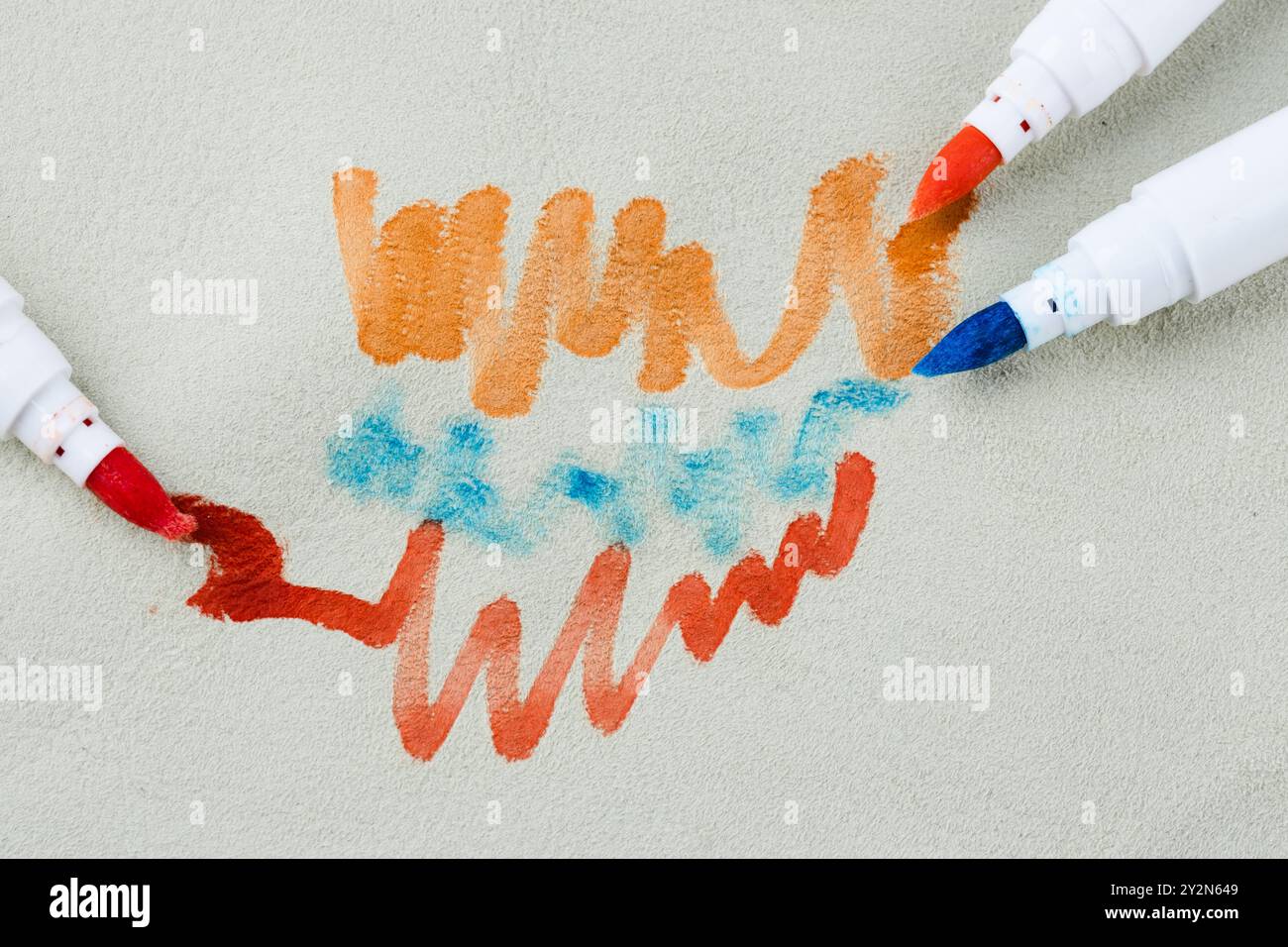 Creative drawing felt-tip pens on the light green upholstered furniture ...