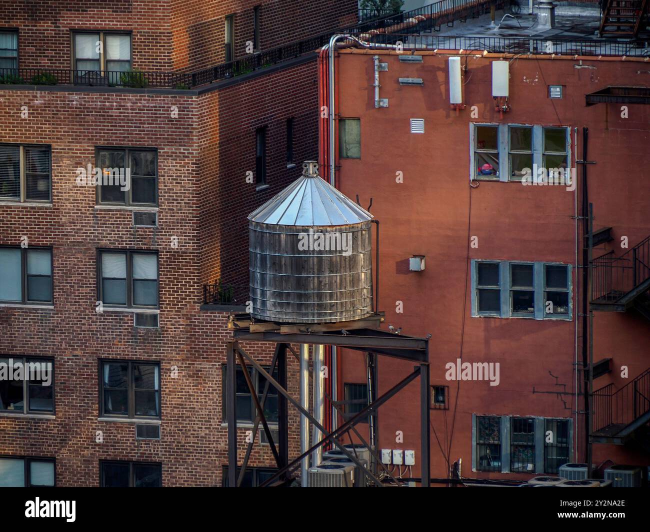 A water tower on the roof of midtown new york manhattan skyscrapers ...