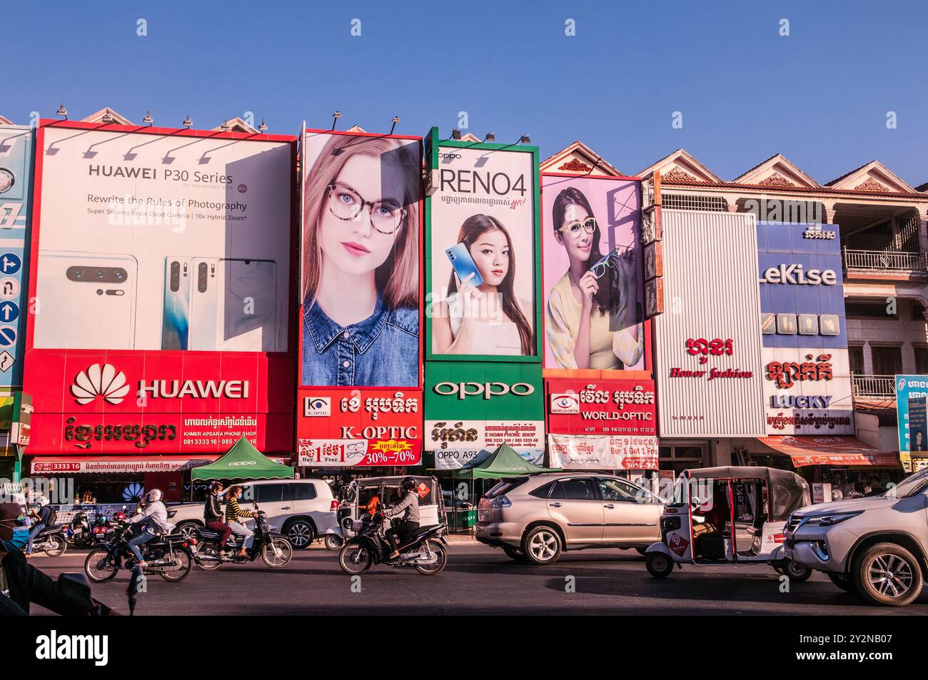 giant billboards for smartphone shops & optical shops w/ traffic below ...