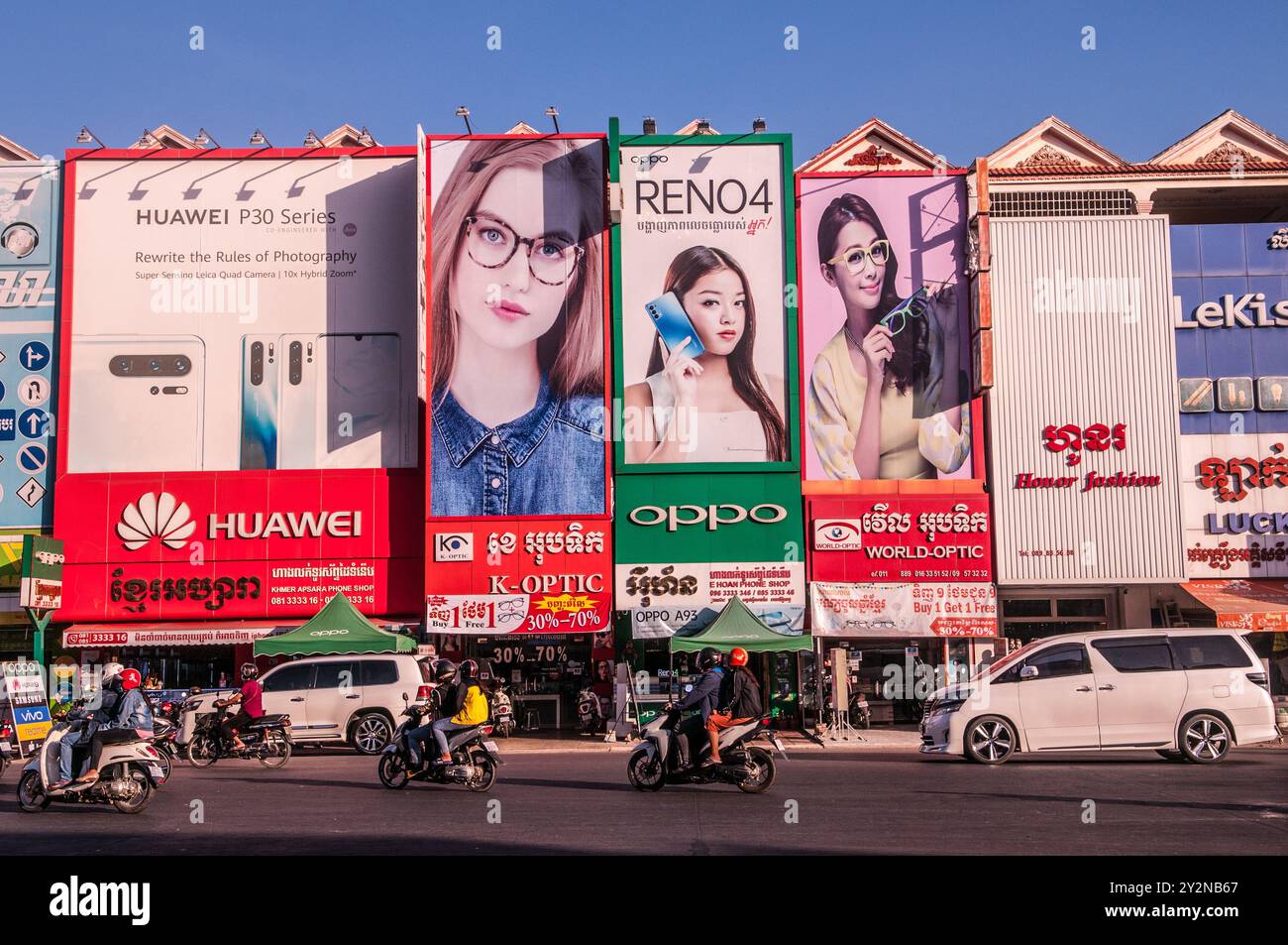 giant billboards for smartphone shops & optical shops w/ traffic below ...