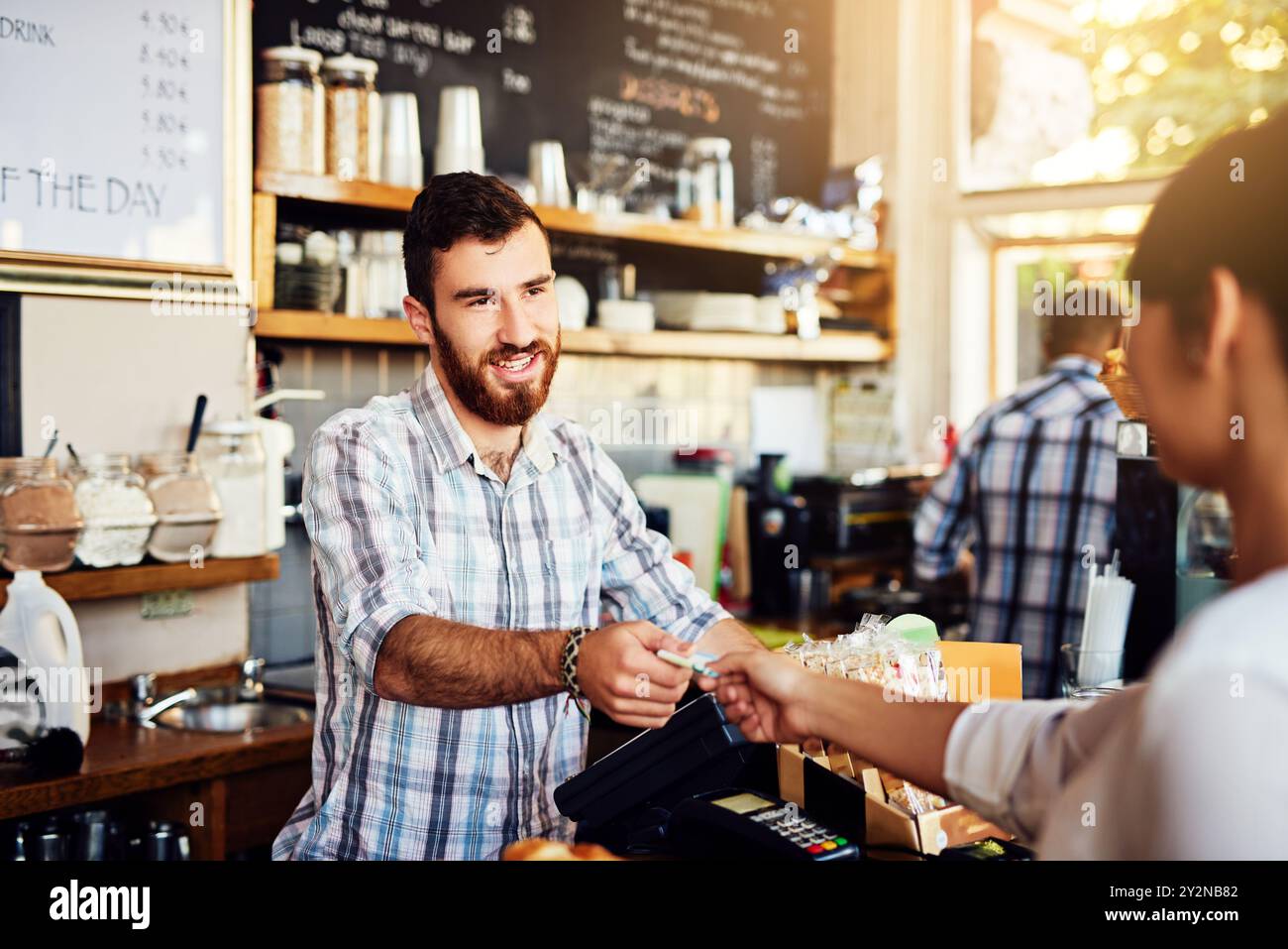 Coffee shop, pay and man with customer for service, checkout and ...