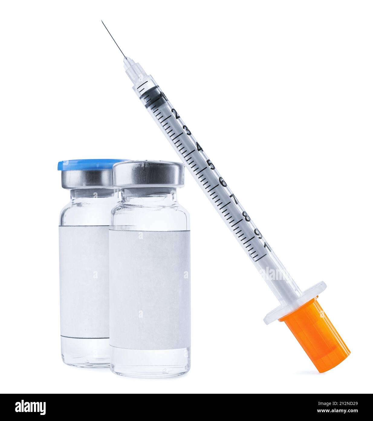 Medication in glass vials with blank labels and syringe on white ...