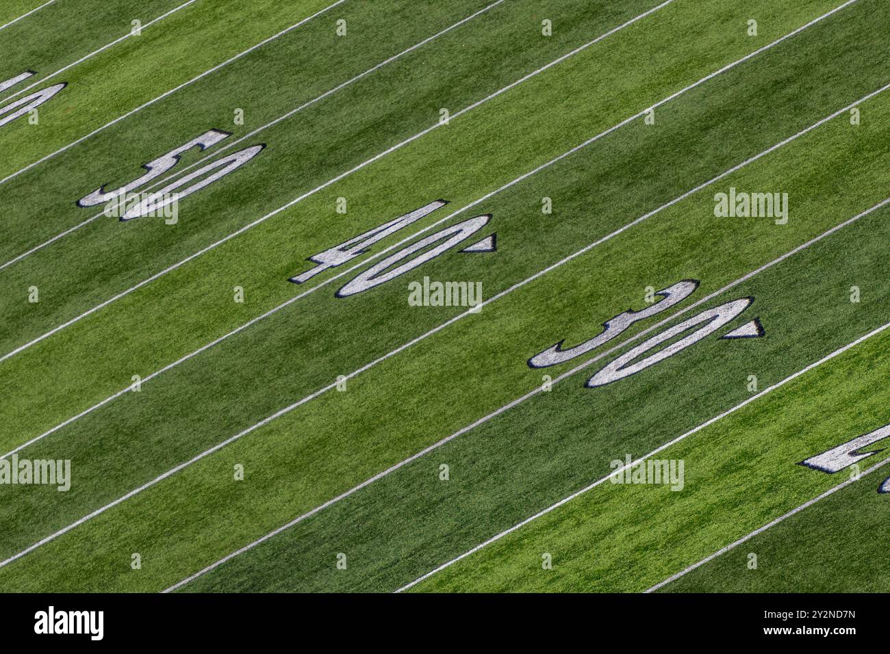 An American football field detail of white chalk drawn lines. 50 and 40 ...