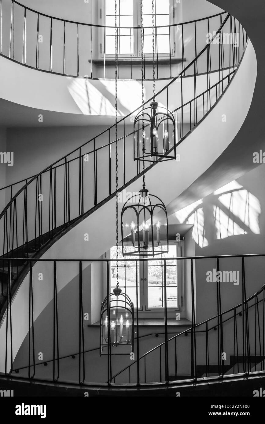 old antique spiral staircase leading upwards against the background of ...