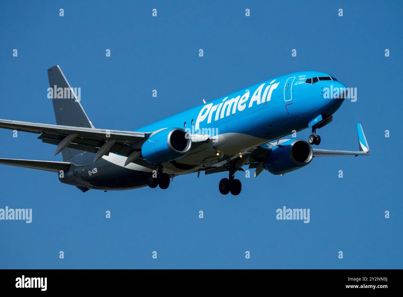 Boeing 737 Plane Amazon Prime Air cargo aircraft flying in clear blue ...