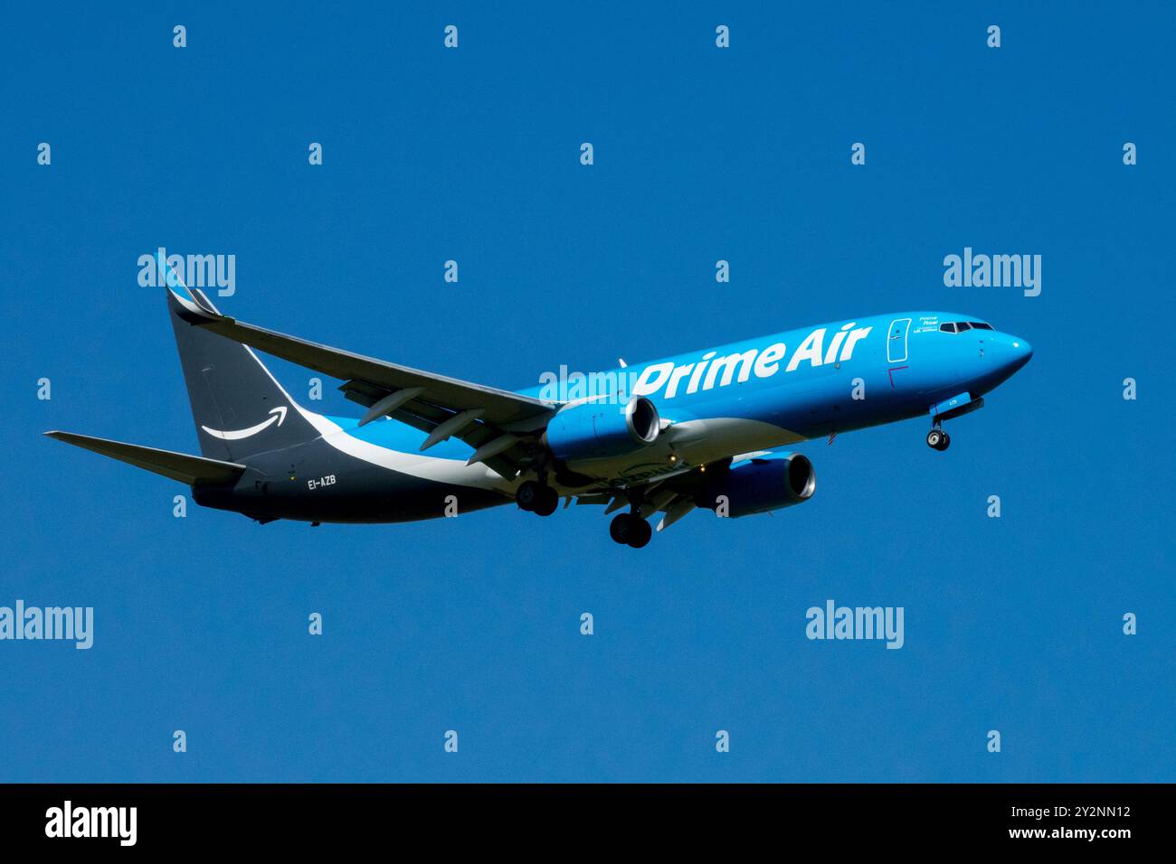 Boeing 737 Aircraft Amazon Prime Air cargo airplane flying in clear ...
